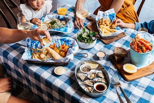 Menu highlights include fish and chips, fish burgers, seafood platters ...